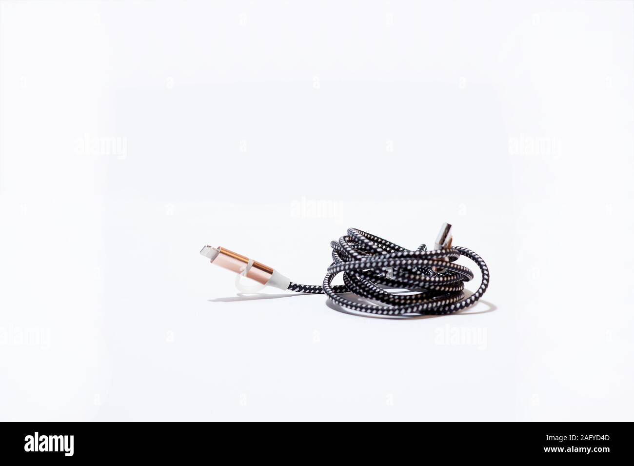 A charging cable on the white background Stock Photo - Alamy