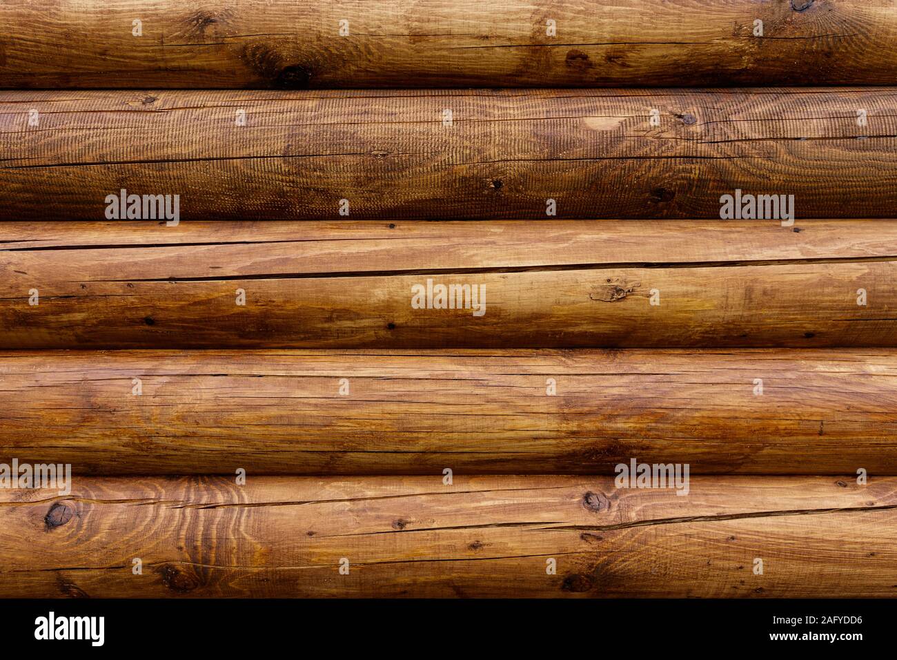 Wooden wall from logs of pine as a background texture Stock Photo - Alamy
