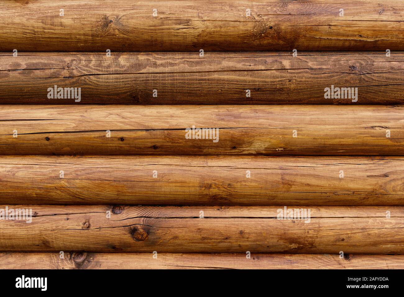 Wooden wall from logs of pine as a background texture Stock Photo - Alamy