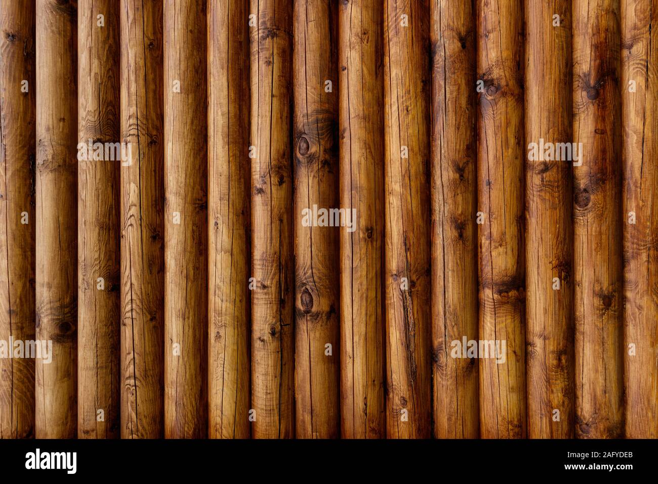 Wooden wall from logs of pine as a background texture Stock Photo - Alamy