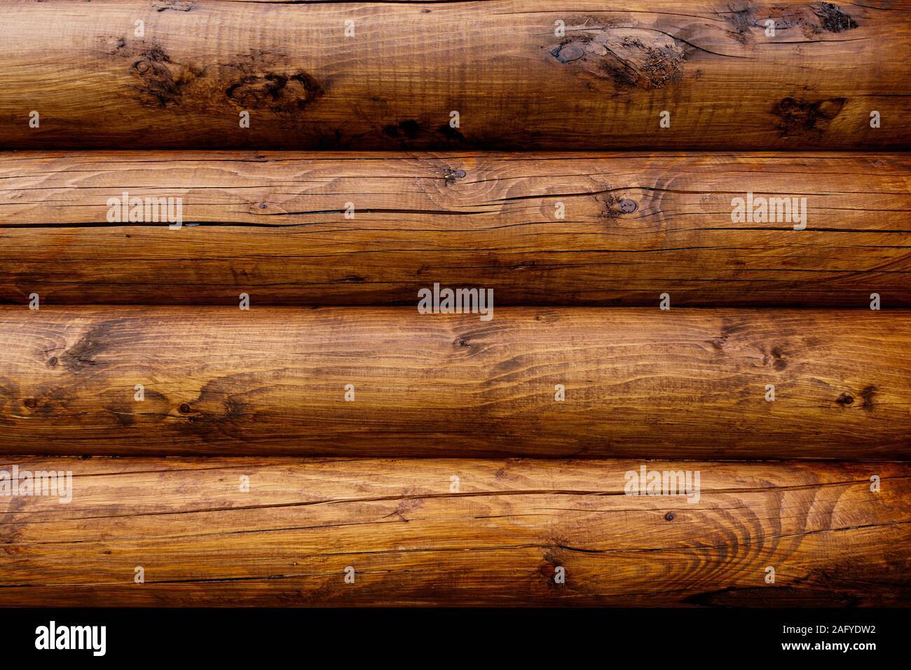 Wooden wall from logs of pine as a background texture Stock Photo - Alamy