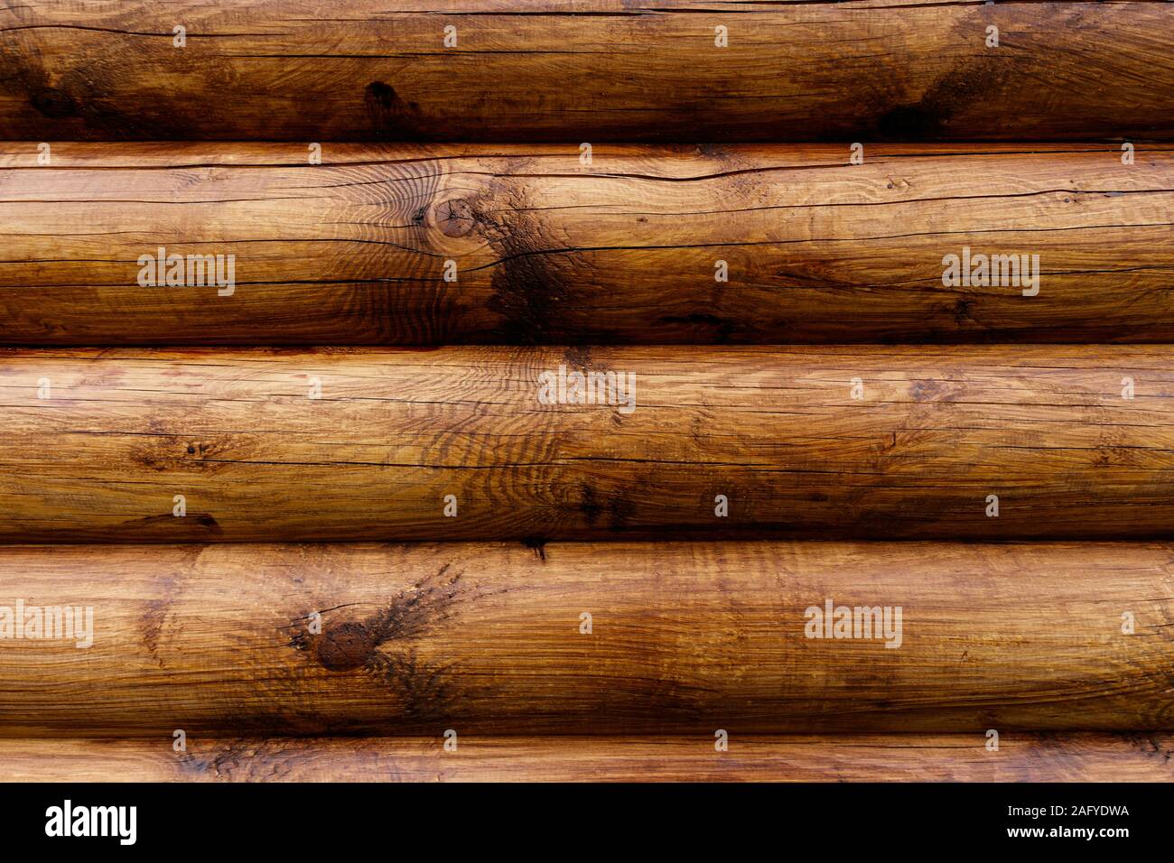 Wooden wall from logs of pine as a background texture Stock Photo - Alamy