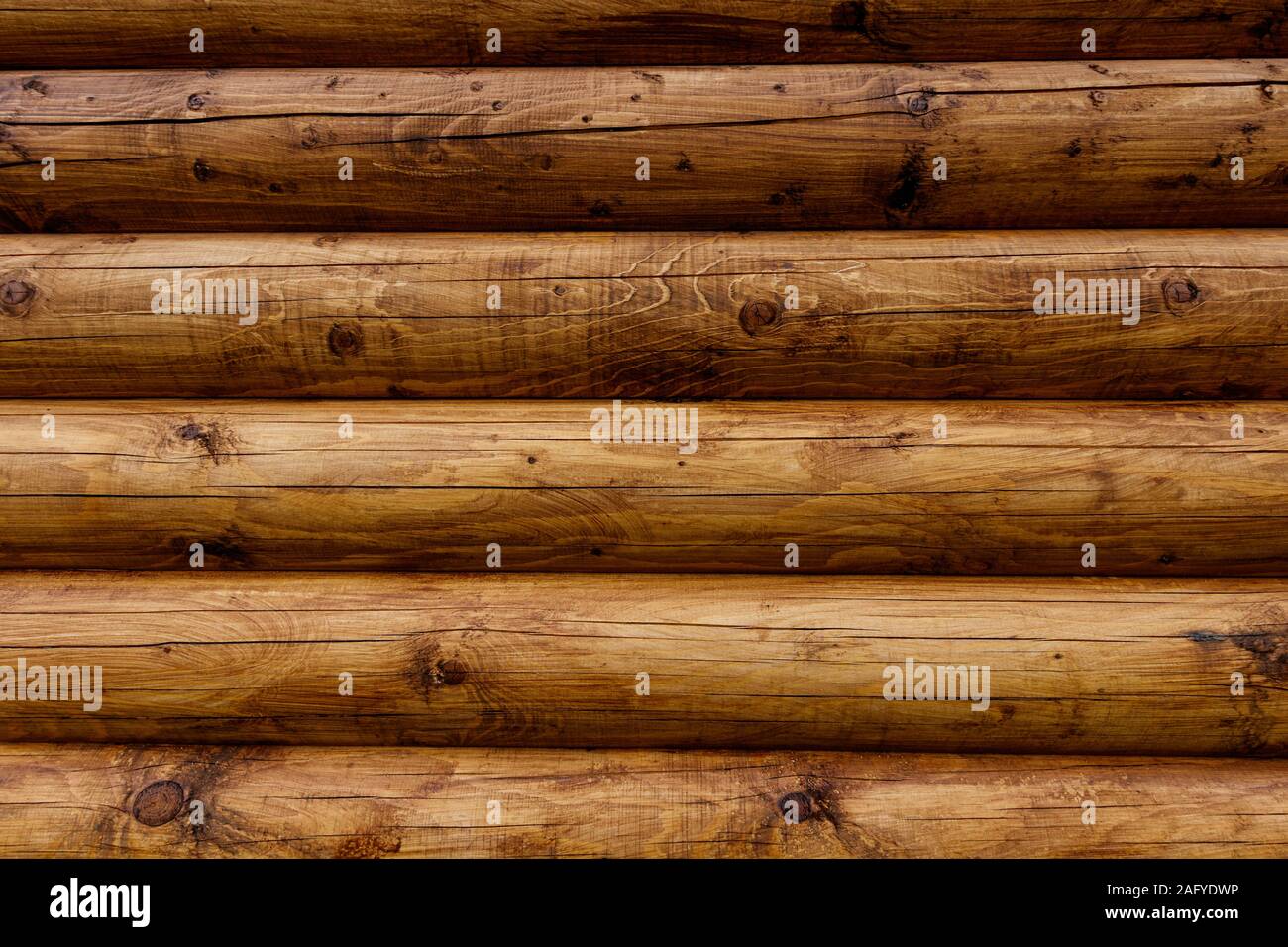 Wooden wall from logs of pine as a background texture Stock Photo - Alamy
