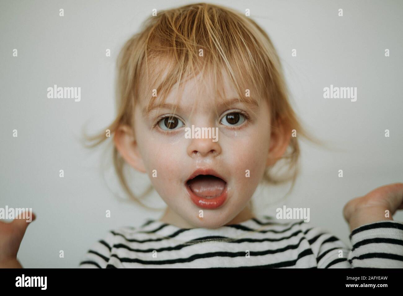 toddler makes surprised face Stock Photo - Alamy