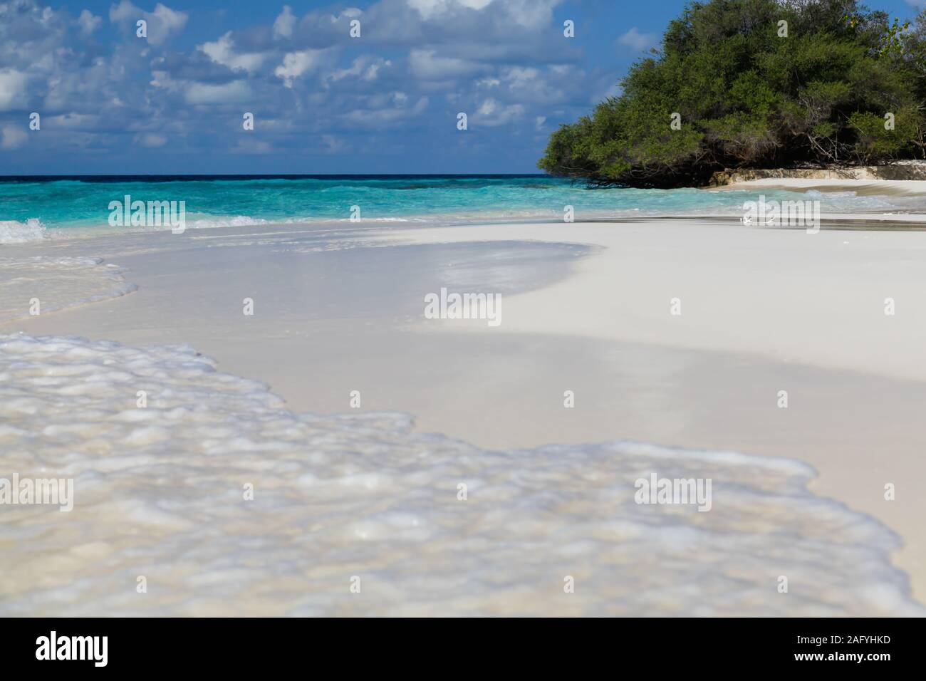 The beach on an island with waves Stock Photo - Alamy