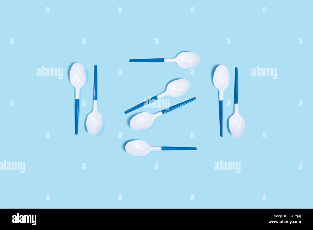 Group of white plastic spoons. Environmental problem of plastic rubbish ...
