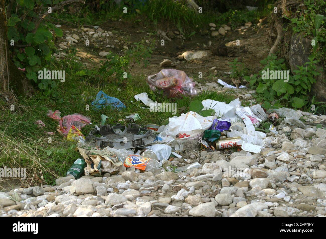 Garbage carelessly thrown away on a river shore in Romania Stock Photo ...
