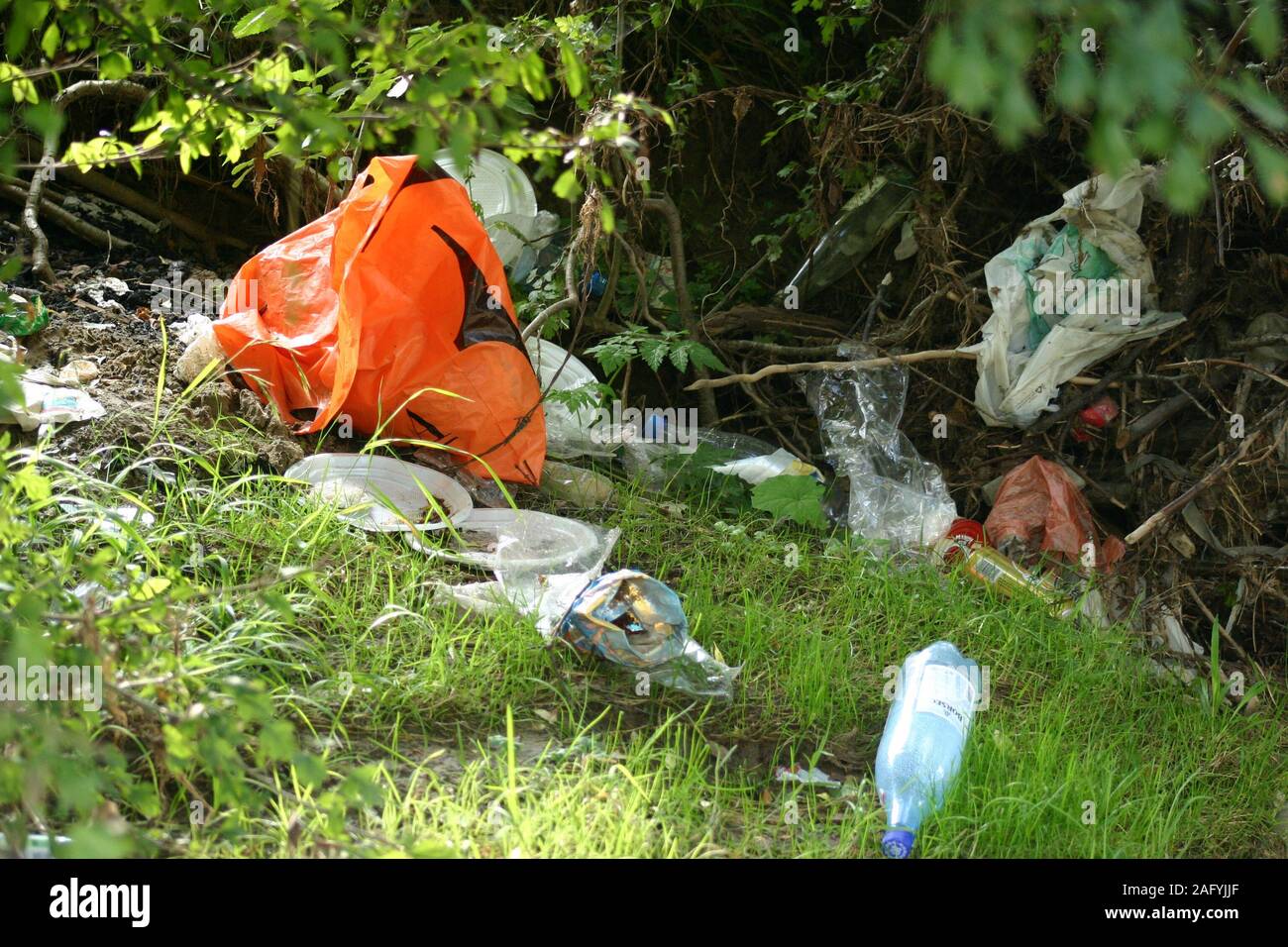 Garbage carelessly thrown away on a field in Romania Stock Photo - Alamy