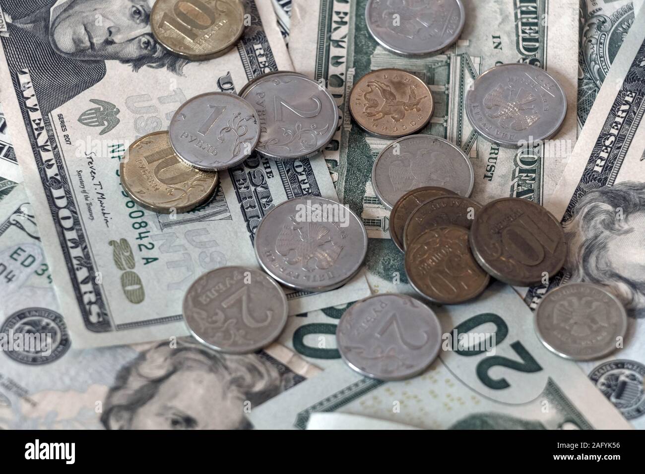 Russian ruble coins, RUB kopeyka on american USD dollar banknote ...