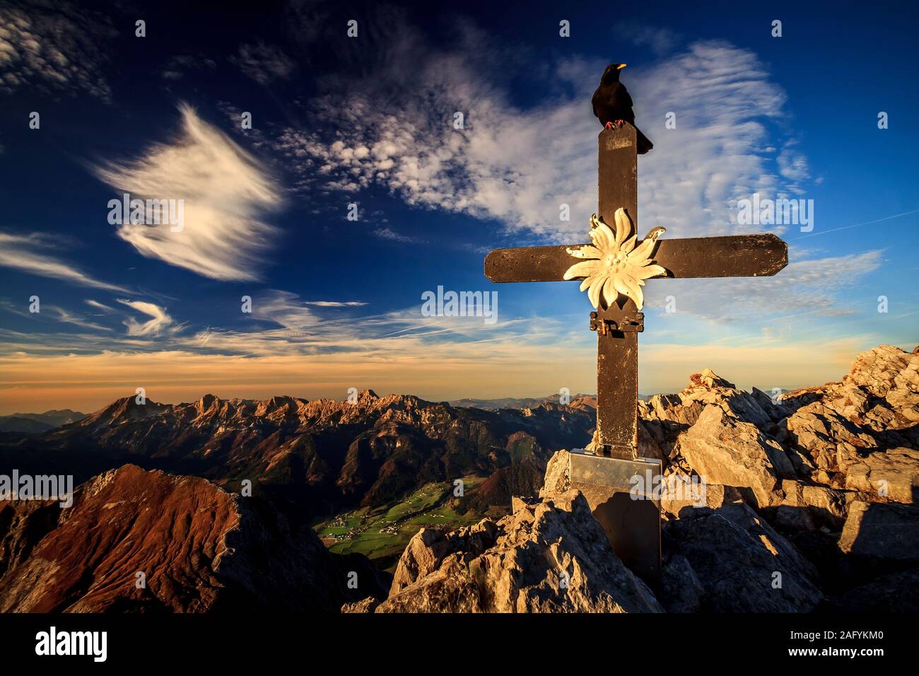 a bird on a cross of the mountain, Austria Stock Photo - Alamy