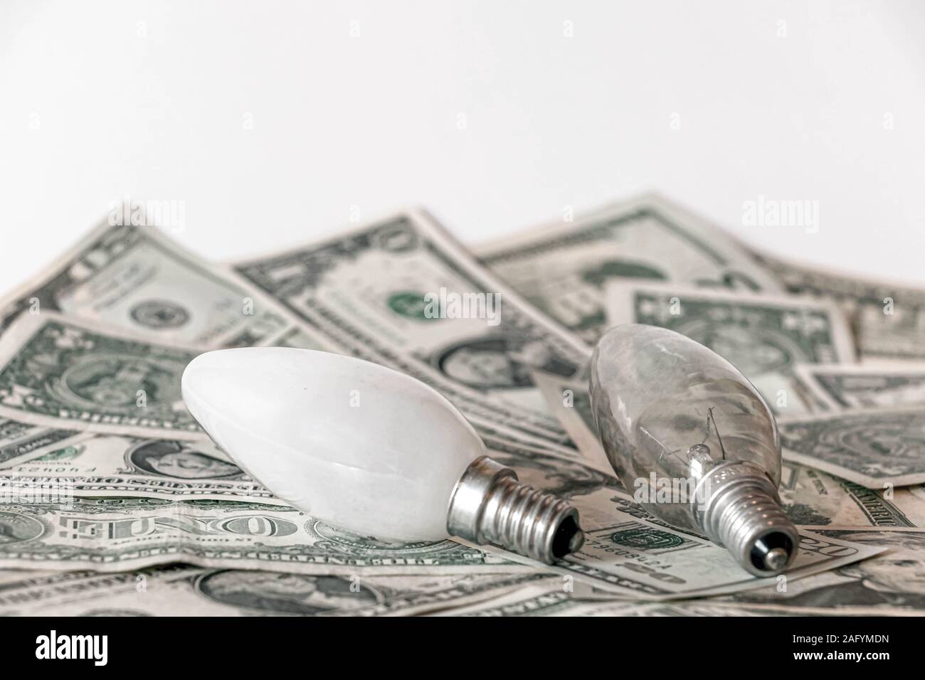 Light bulbs on the usd american dollar background Stock Photo - Alamy
