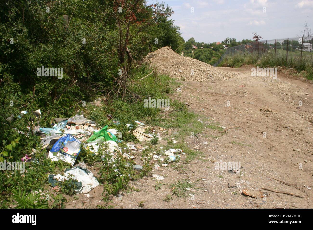 Trash dumped carelessly in unauthorized places in Romania's countryside ...