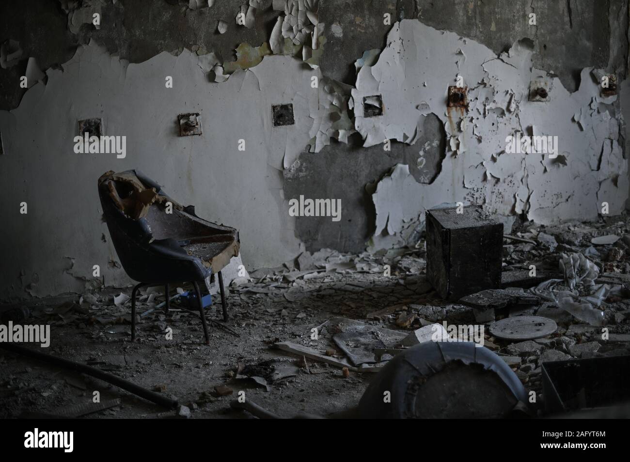 empty destroyed room with chairs and broken walls during war conflict ...