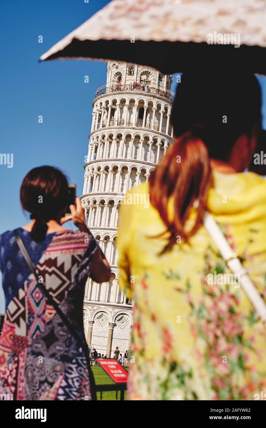 Summer tourists taking photos of the Leaning Tower of Pisa, Pisa ...