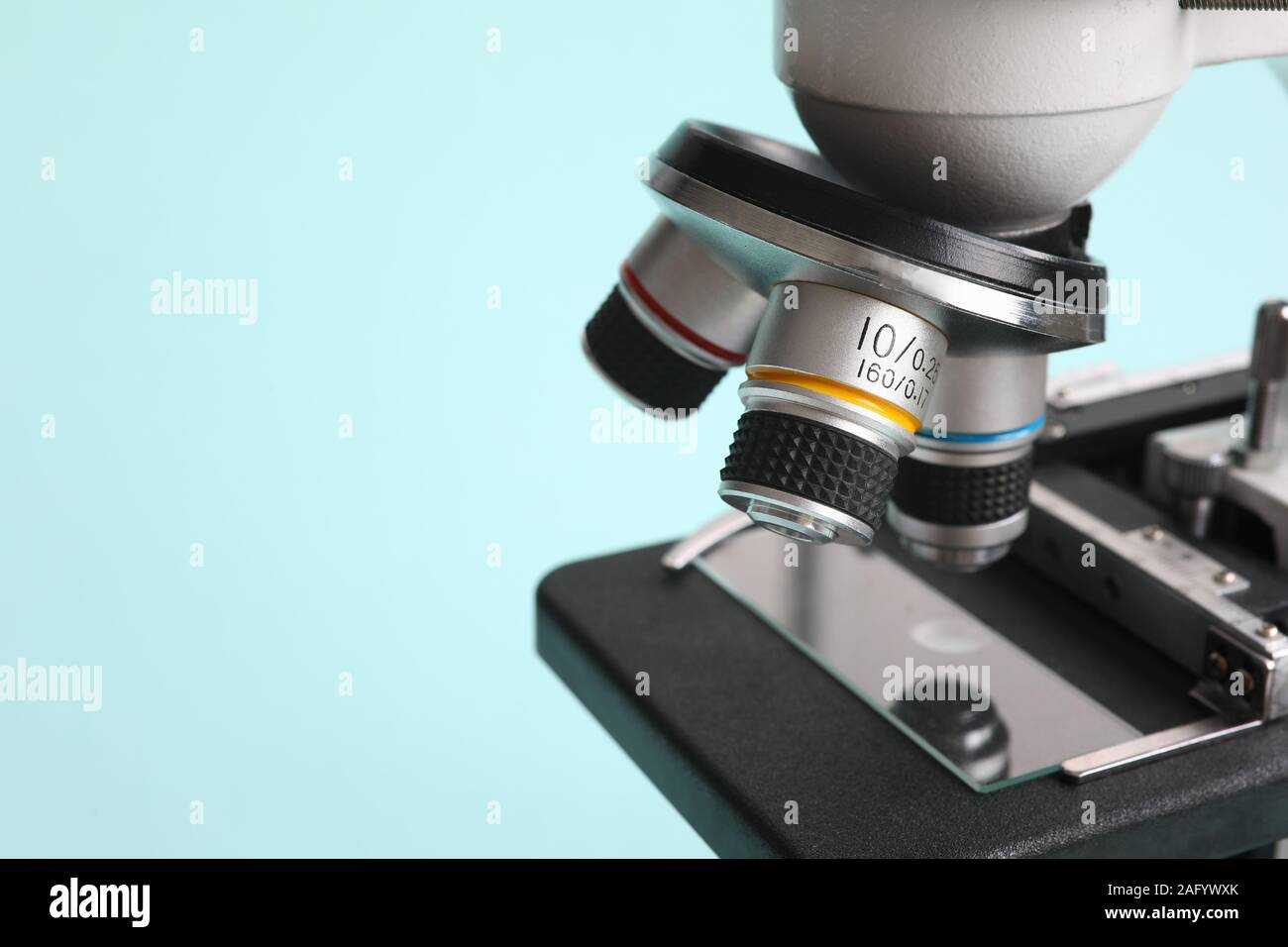 Chemistry microscope on modern blue background Stock Photo - Alamy