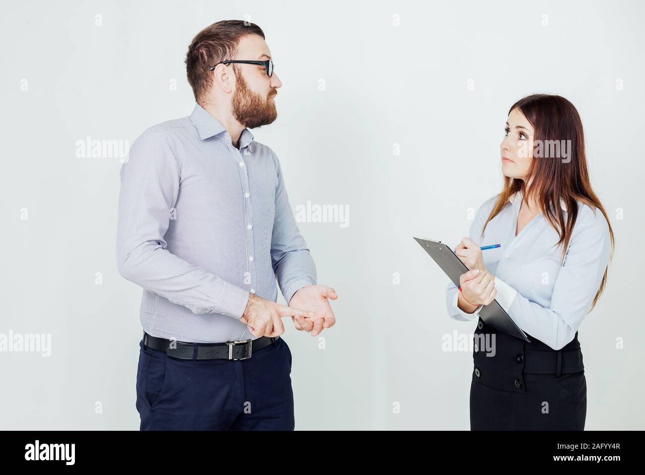 the boss tells the worker what to do in the Office Stock Photo - Alamy
