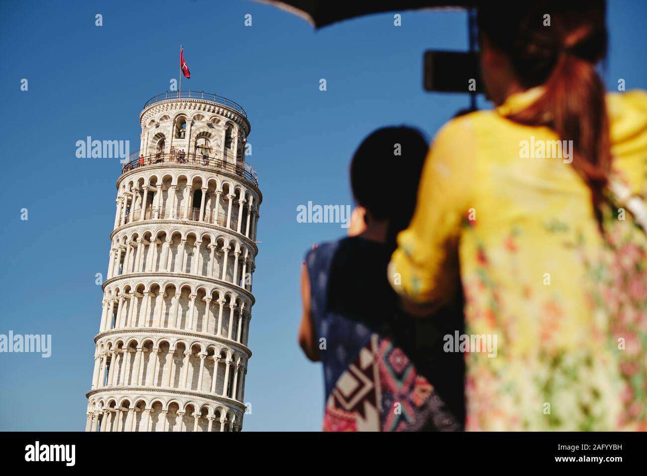 Summer tourists taking photos of the Leaning Tower of Pisa, Pisa ...