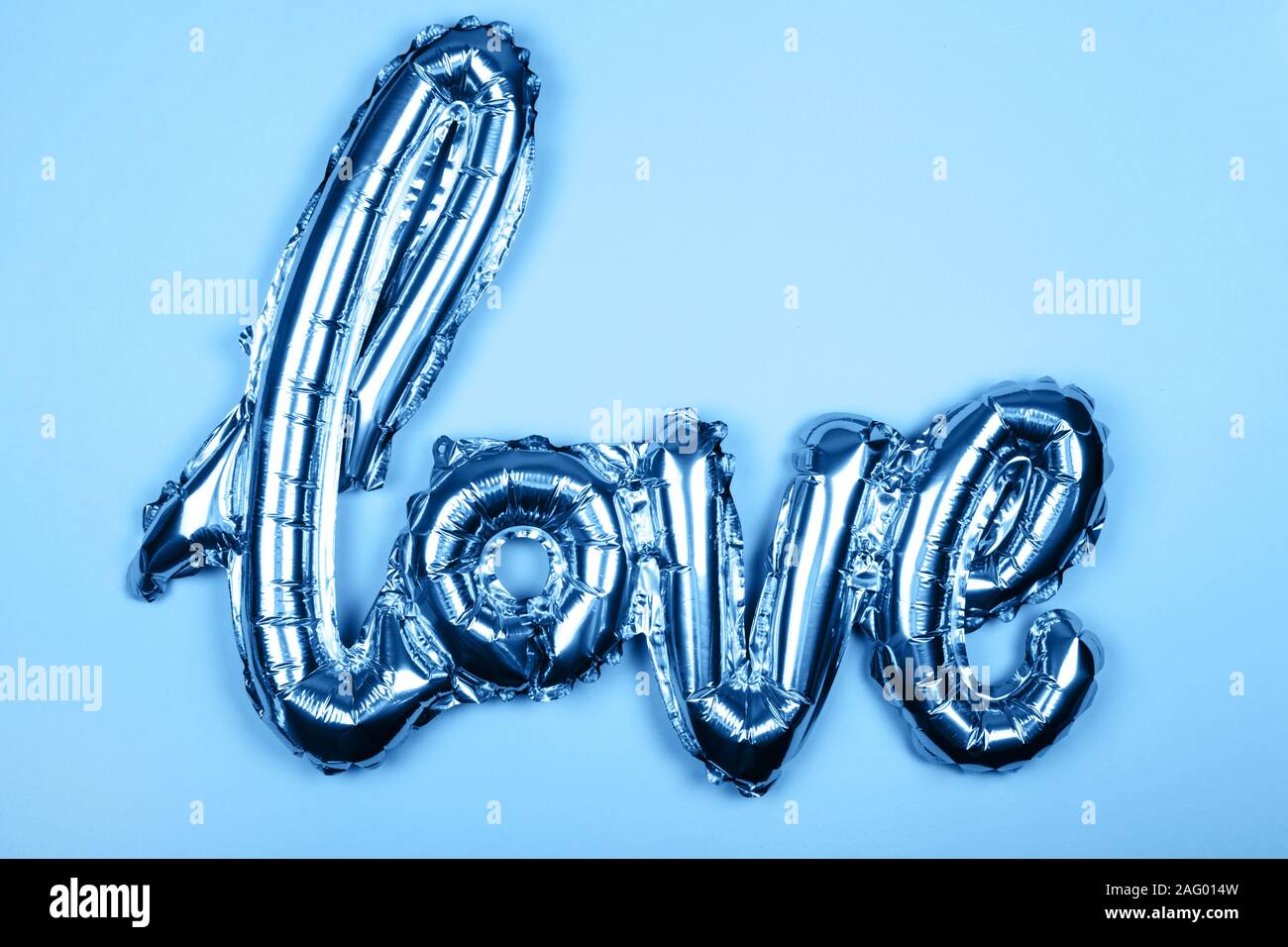 Love foil balloon on monochrome colorful backdrop. Valentines day ...