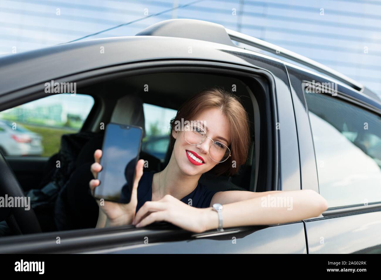 Woman driver gets red automobile hi-res stock photography and images ...