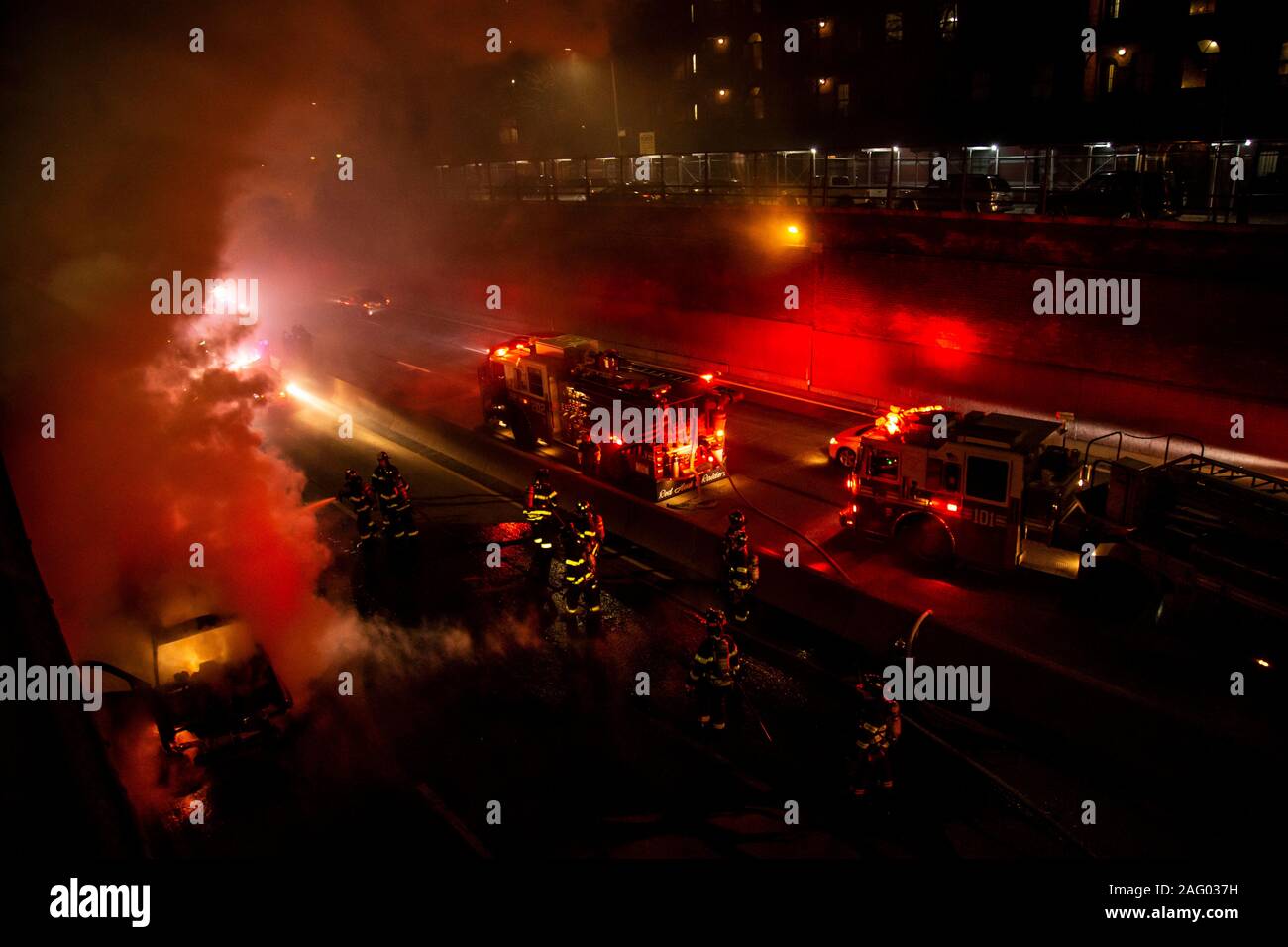 New York City Firefighters douse a car fare on Brooklyn, NY's Brooklyn ...
