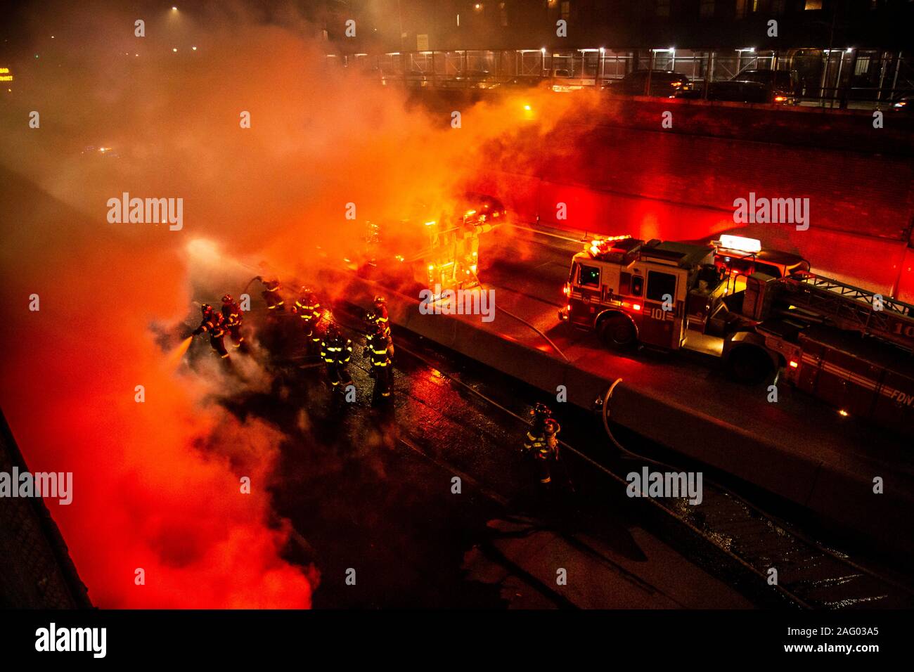 New York City Firefighters douse a car fare on Brooklyn, NY's Brooklyn ...