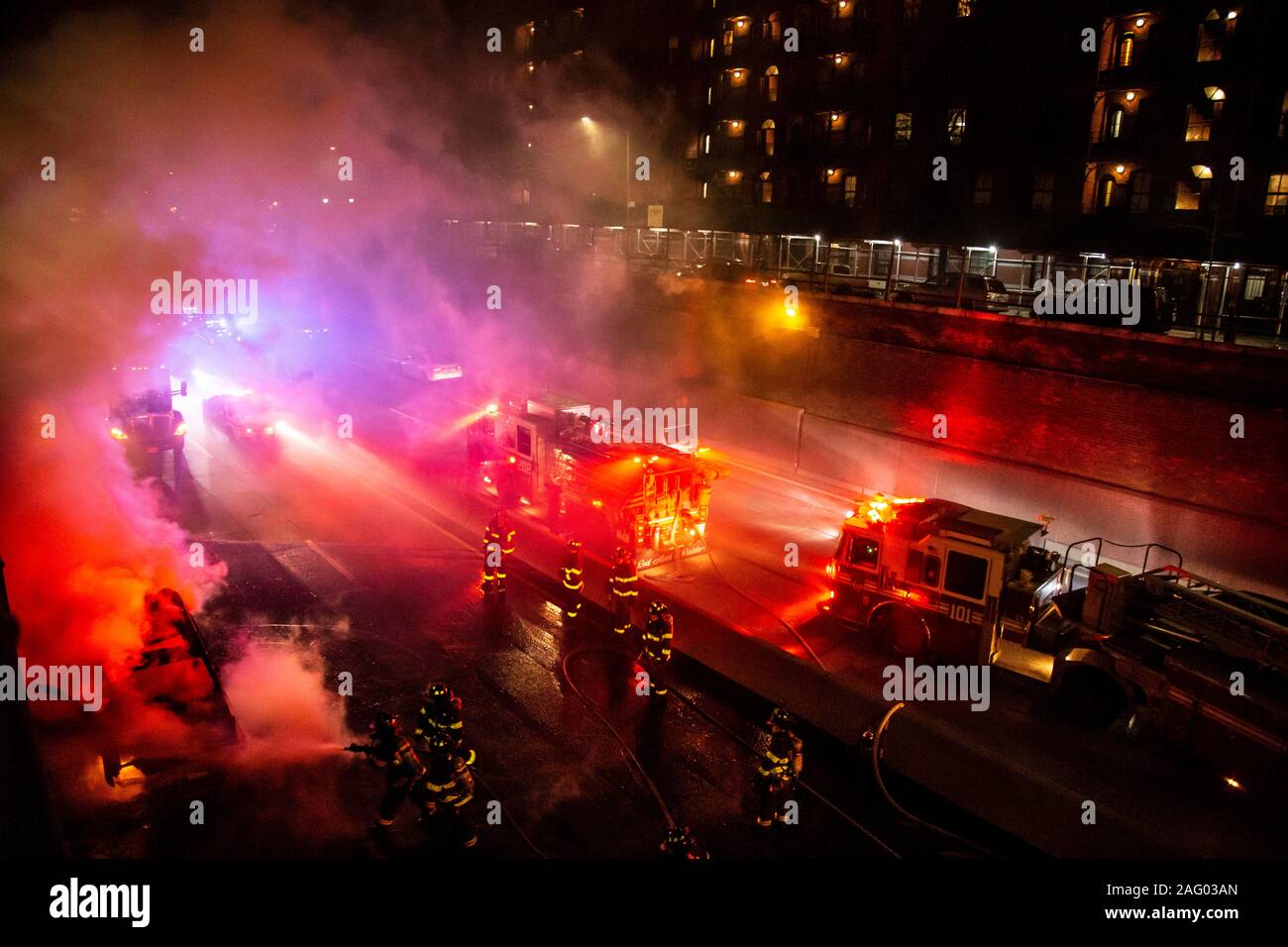 New York City Firefighters douse a car fare on Brooklyn, NY's Brooklyn ...
