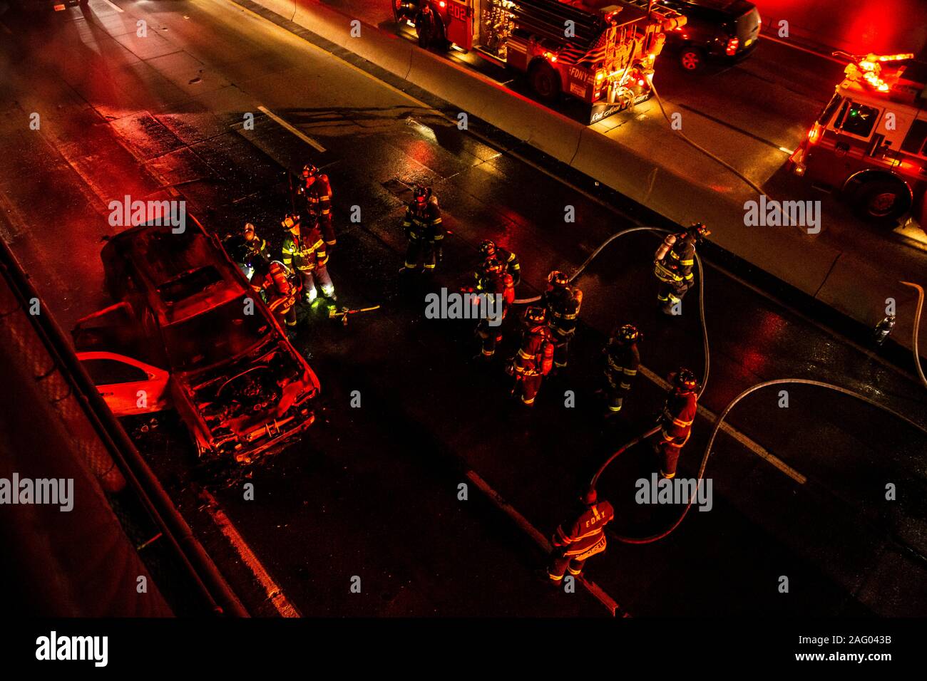 New York City Firefighters douse a car fare on Brooklyn, NY's Brooklyn ...