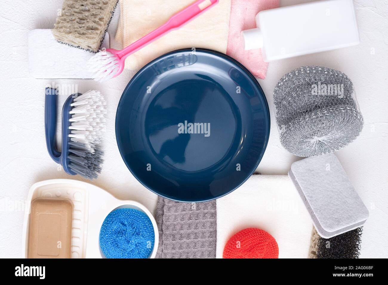 Dish washing accessories on white flat lay background. Washing up ...