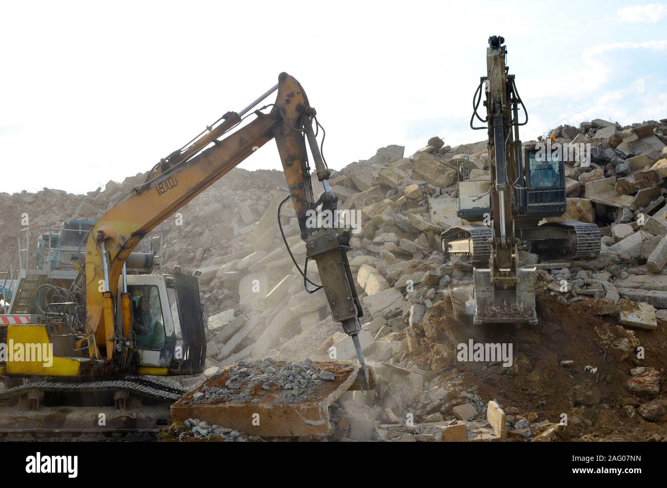 Salvaging and recycling building and construction materials. Excavator ...