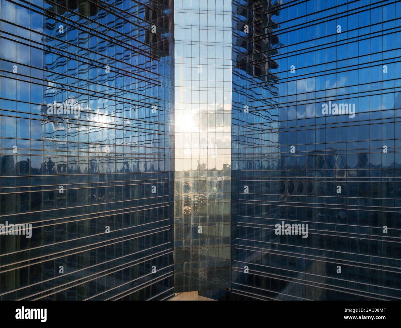 Reflection on a glass facade of office building Stock Photo - Alamy