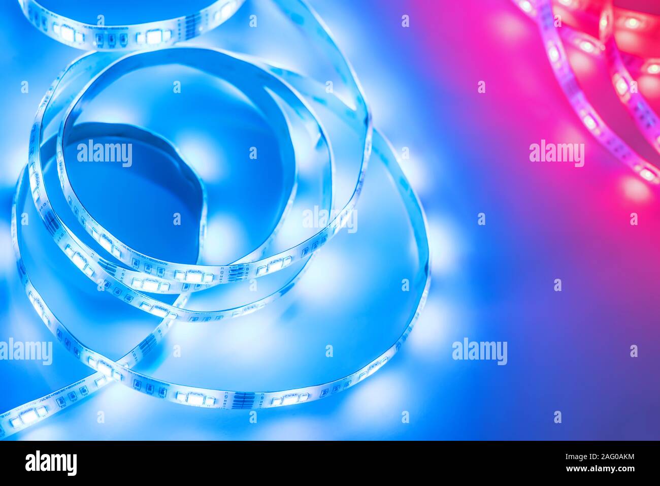 Bright neon LED strip glows blue and red. Copyspace Stock Photo - Alamy