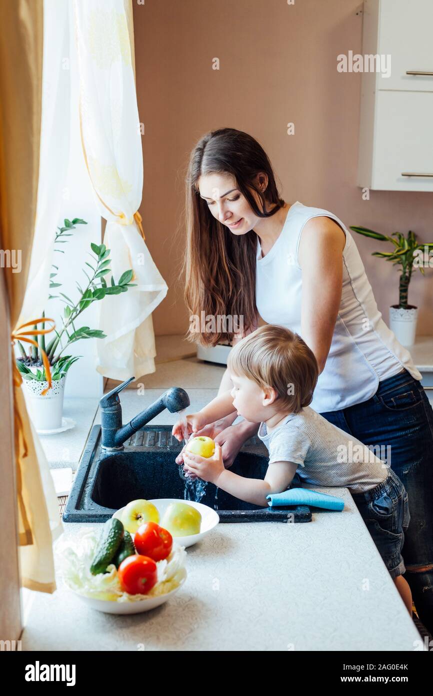 Boy girl helping house chores hi-res stock photography and images - Alamy