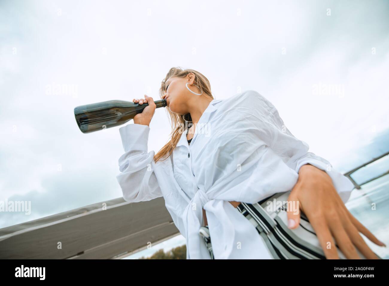 Holding Beer Bottle By The Neck