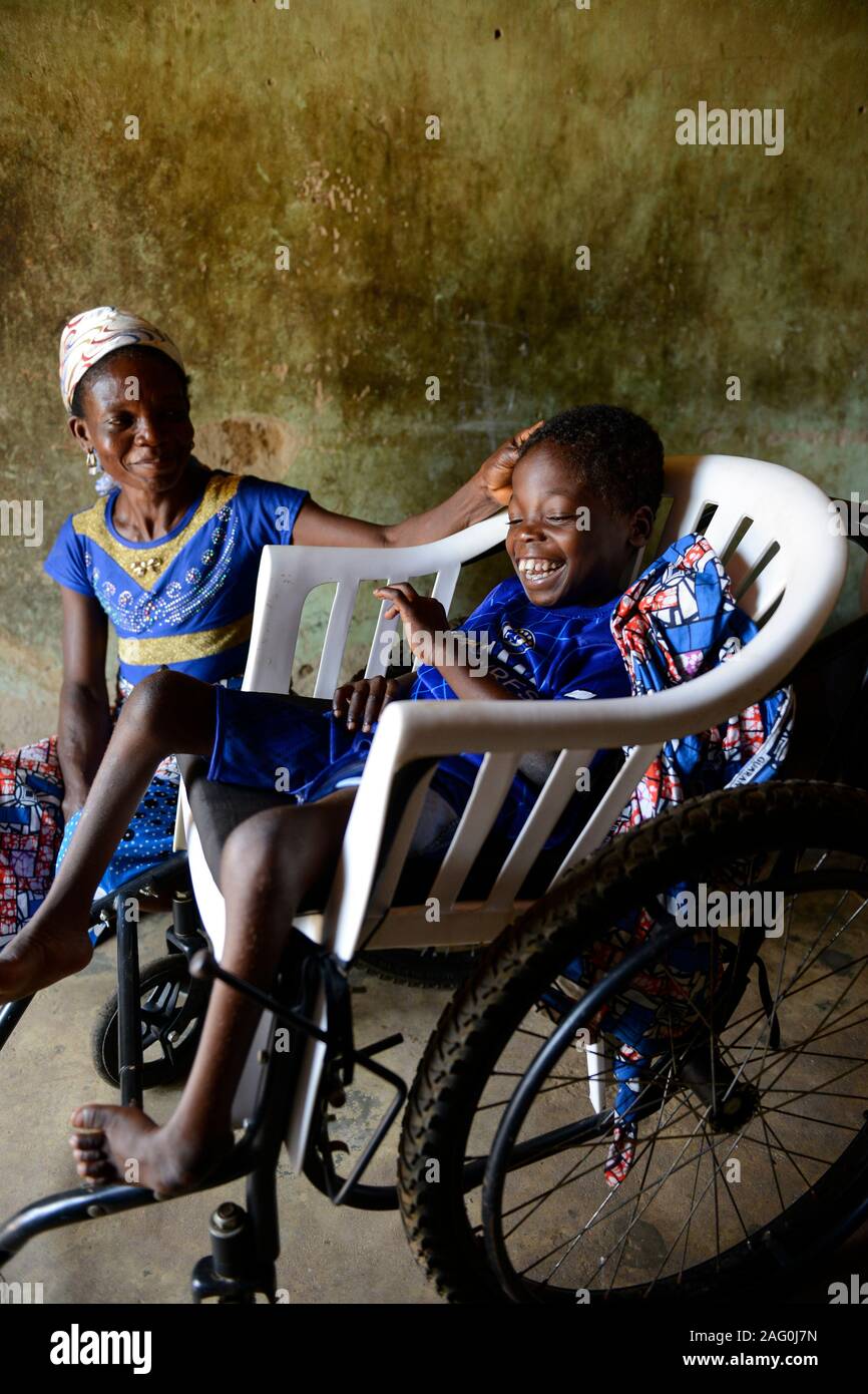 TOGO, Tohoun, village ADJIKAME, young handicapped boy in wheelchair ...