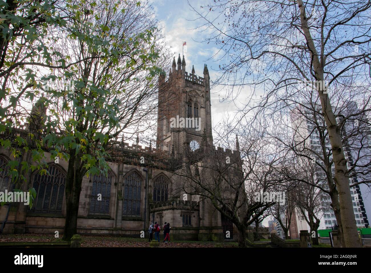 Manchester Cathedral Behind Trees At Manchester England 2019 Stock ...