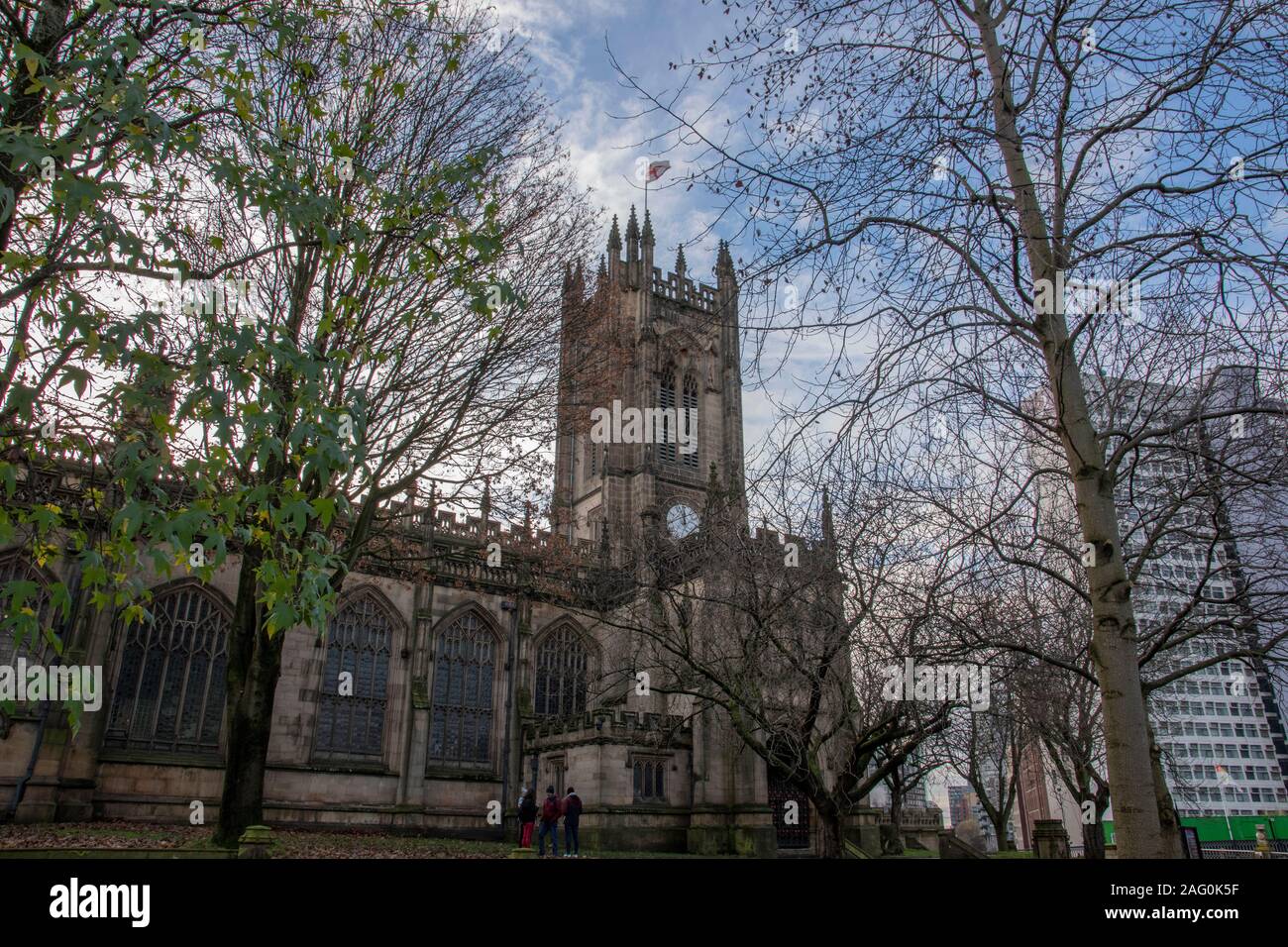 Manchester Cathedral Behind Trees At Manchester England 2019 Stock ...