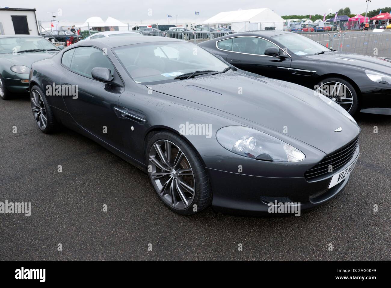 Three-quarter front view of a Silver, 2005, Aston Martin DB9, on ...