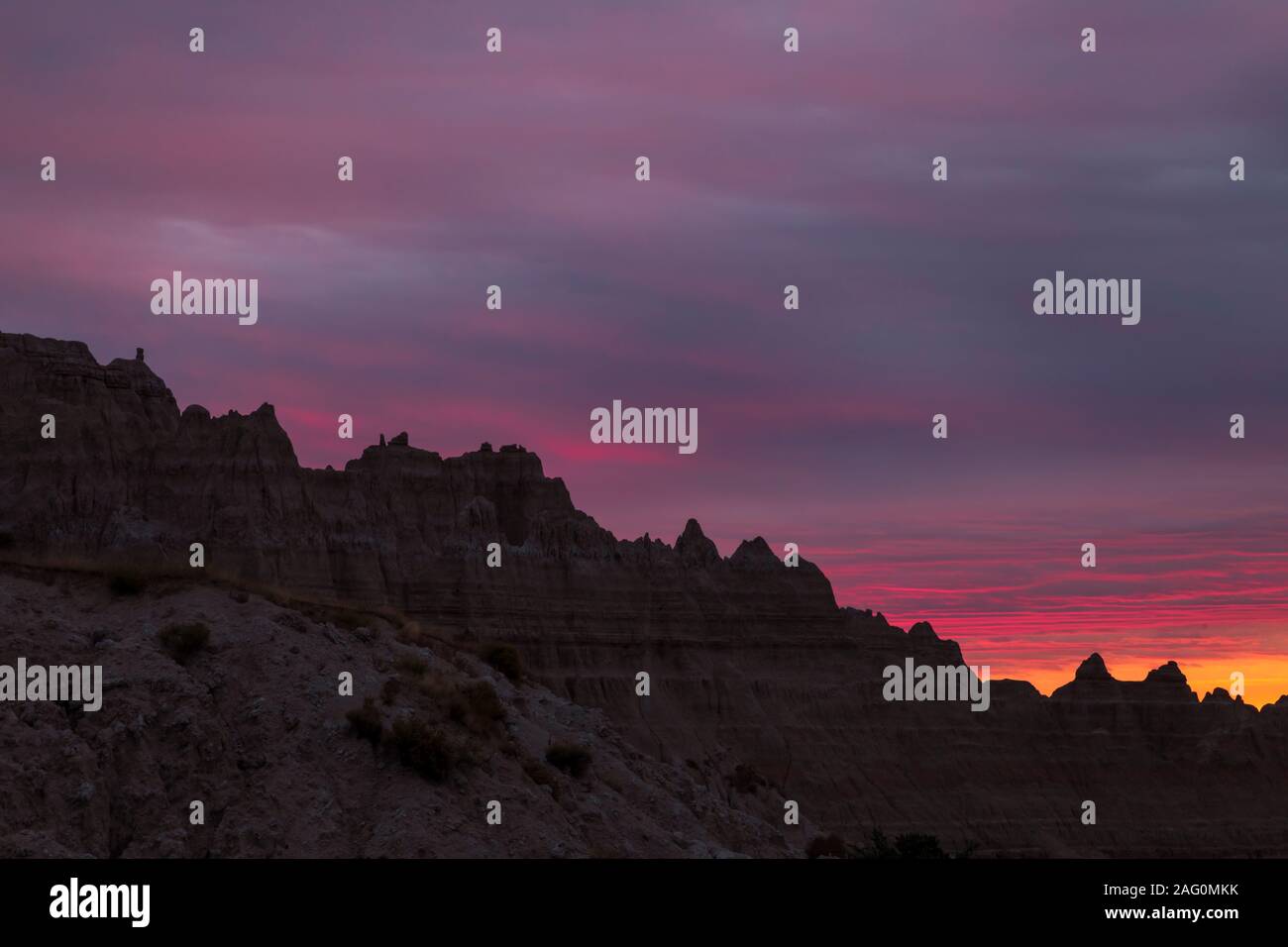 Sunrise over the badlands from Cedar Pass in Badlands National Park ...