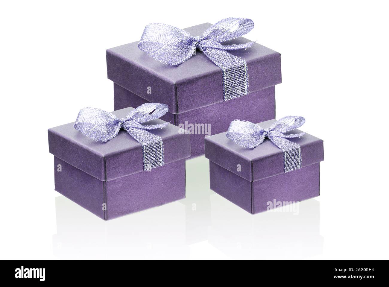 Three lilac gift boxes isolate on a white background, close-up ...