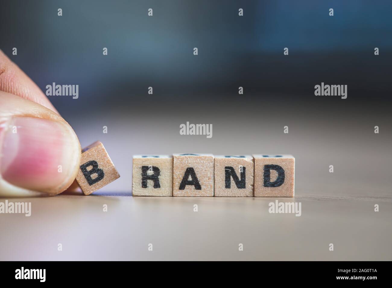 Wood cubes with the word “Brand”, close up picture with copy space ...