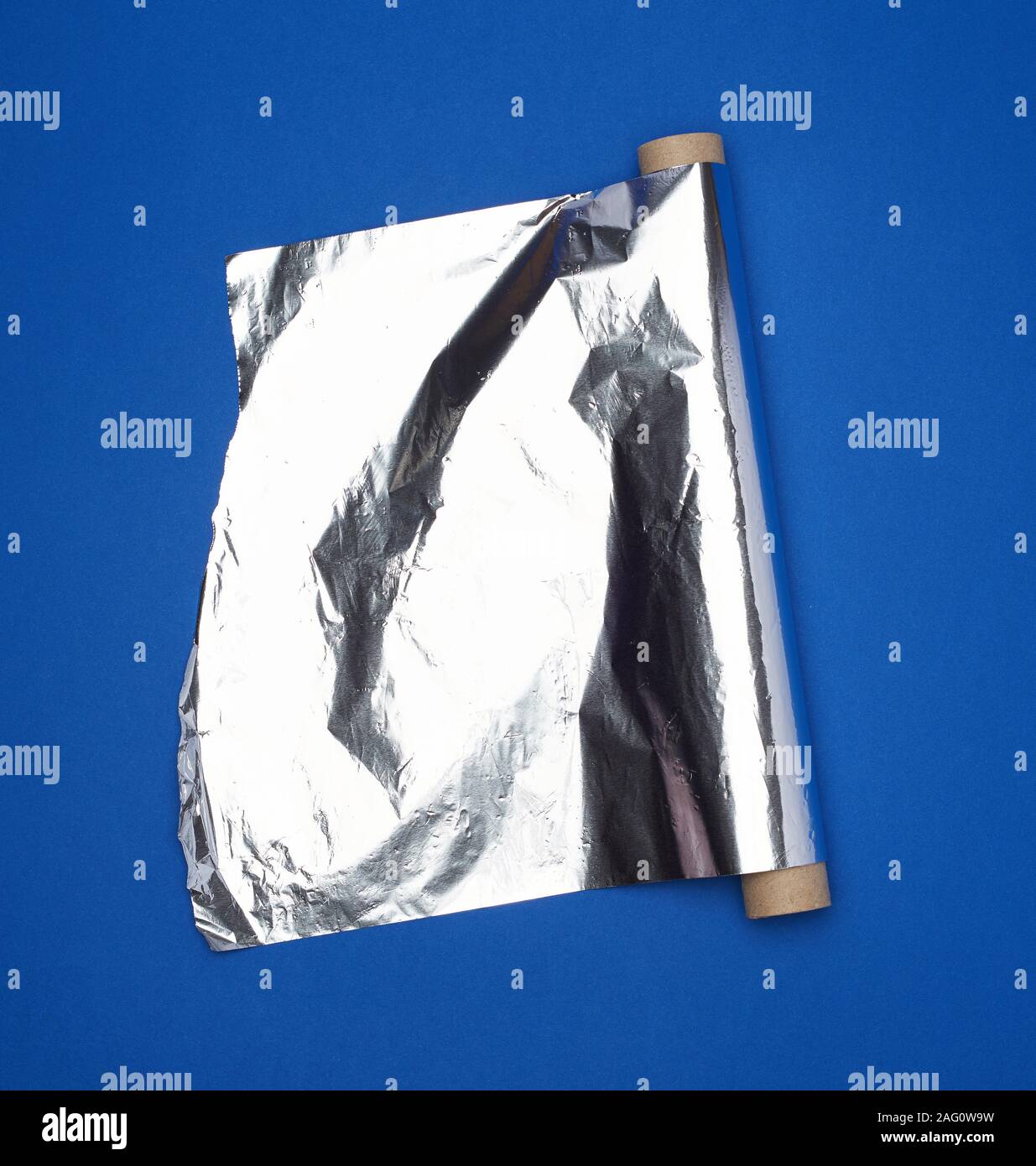 roll of gray foil for baking and packaging food on a dark blue ...