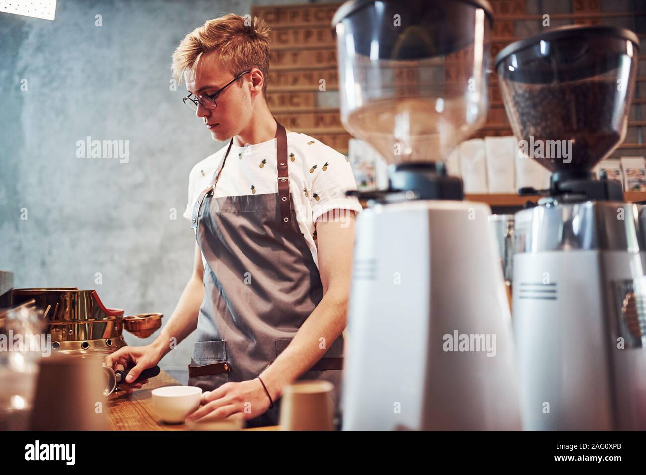 Young male cafe worker indoors. Conception of business and service ...