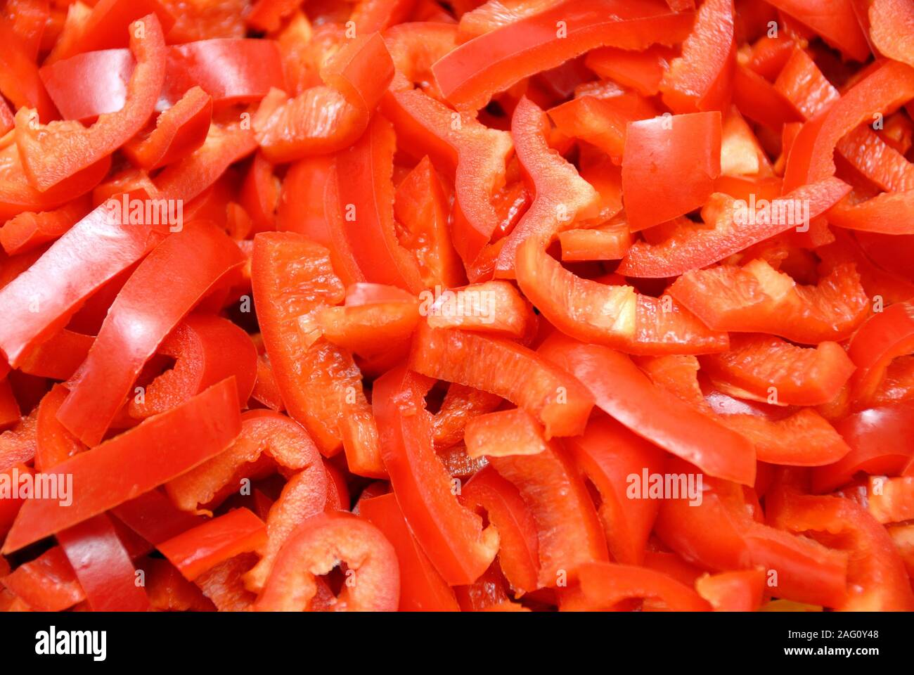 Background from the cut fresh pepper of red colour Stock Photo - Alamy