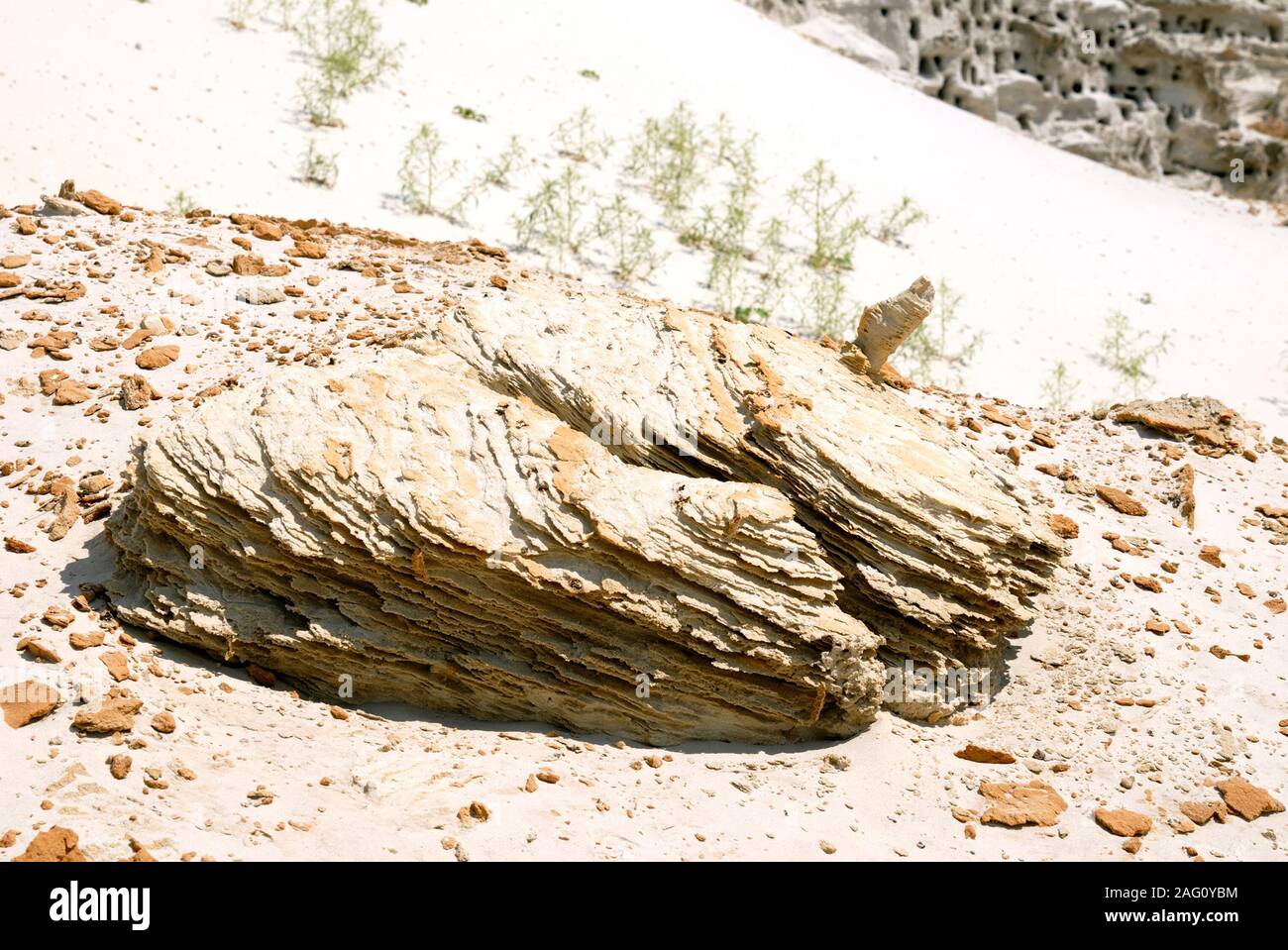 Sculptures from sand against a slope of sandy mountain Stock Photo - Alamy