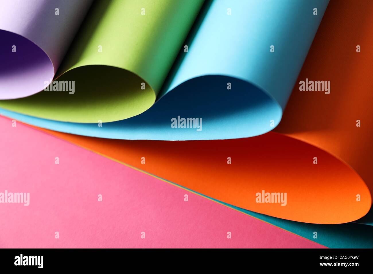 Color sheets on pink background, close up. Abstract background Stock ...