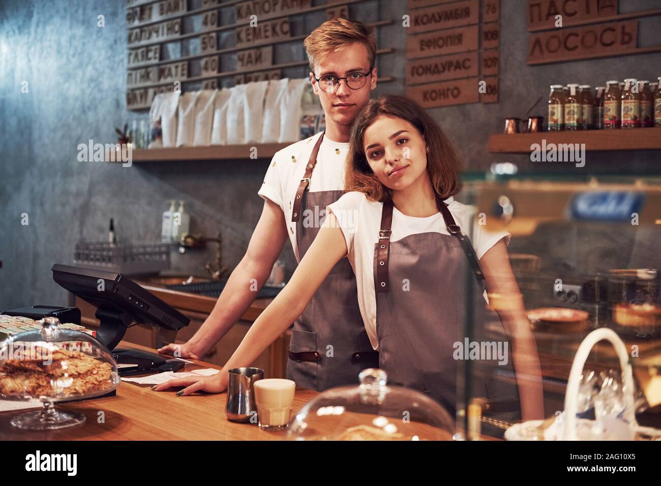 Happy people. Two young cafe workers indoors. Conception of business ...