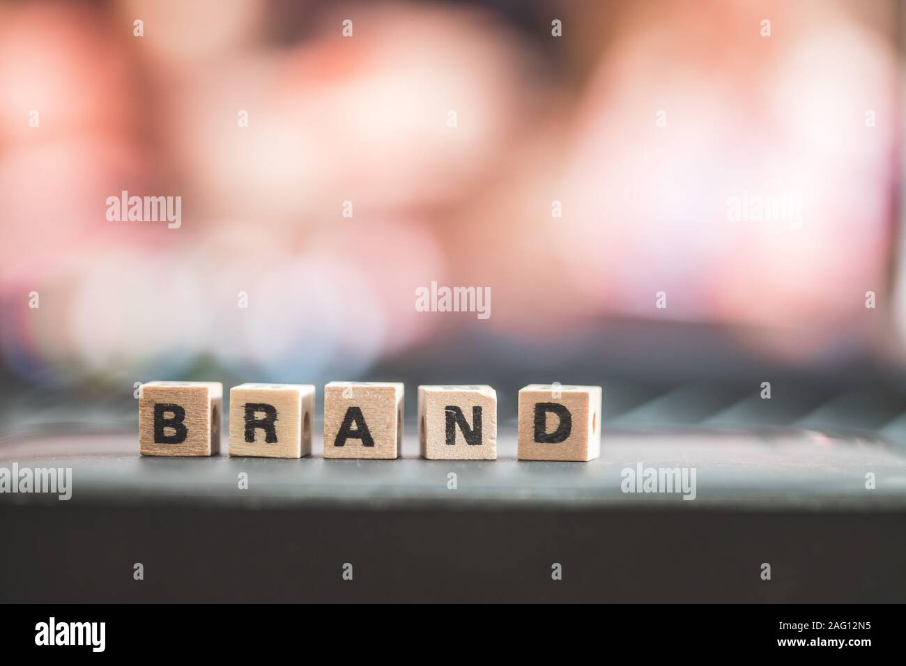 Wood cubes with the word “Brand”, close up picture with copy space ...