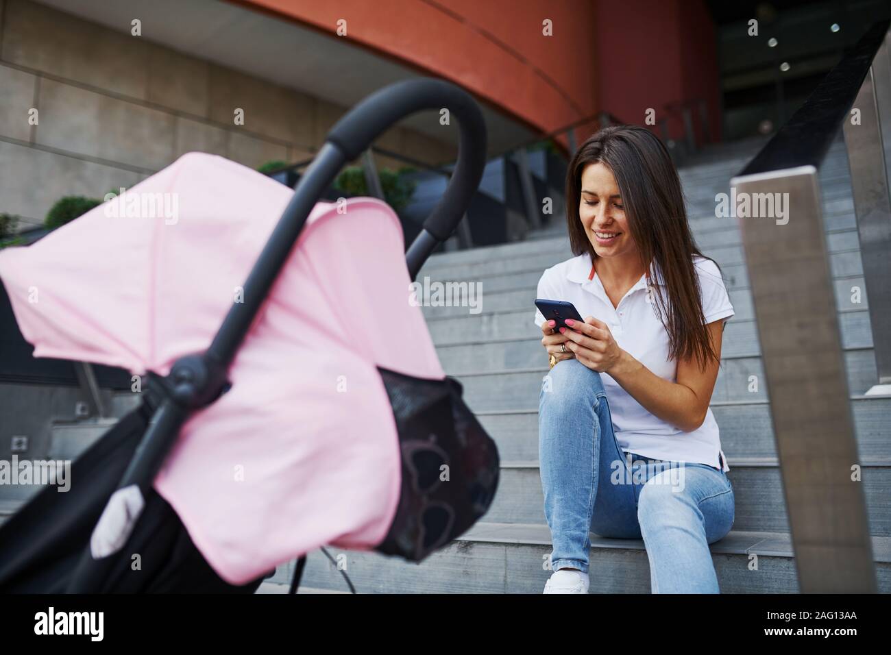 Person with pram hi-res stock photography and images - Alamy