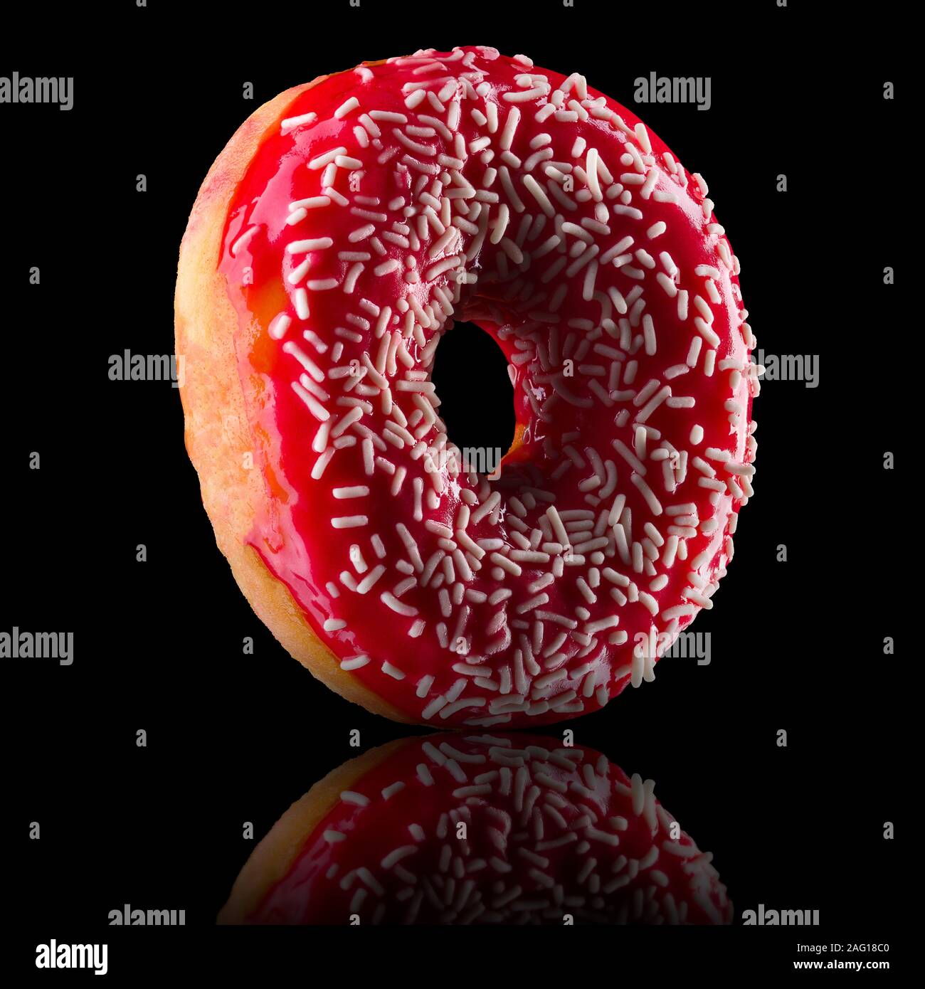 Glazed donut with reflection on a black background rotated in three ...