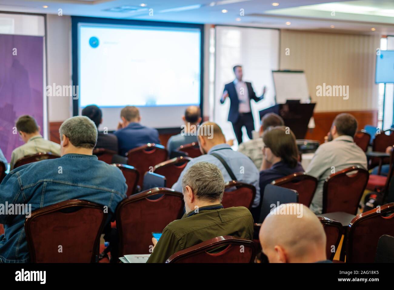 Audience listens lecturer at workshop Stock Photo - Alamy